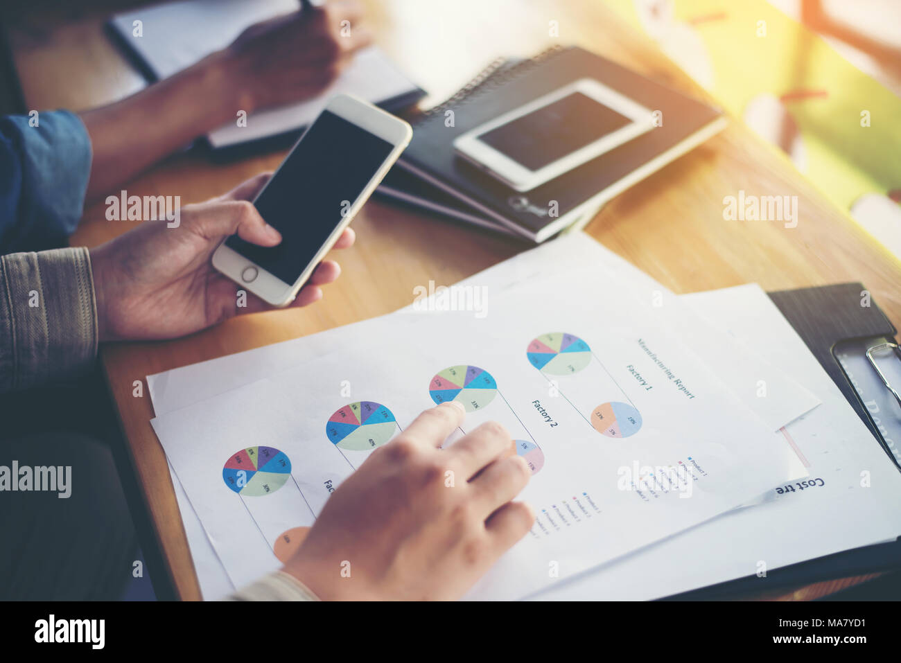 business woman hand working on smart phone with business graph ...