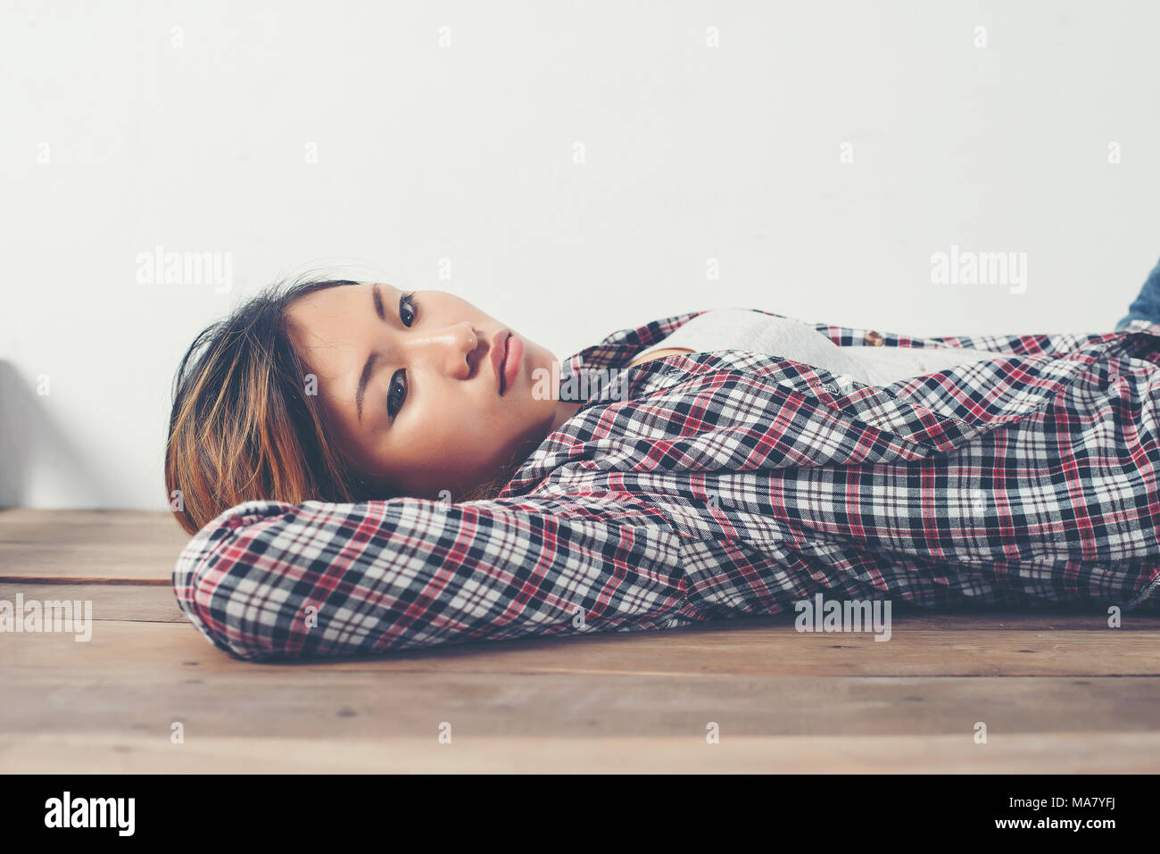 Woman lay floor sad hi-res stock photography and images - Alamy