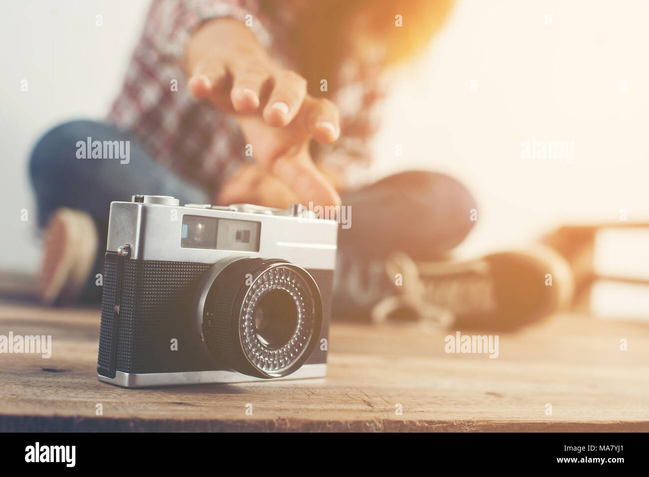 Young hipster woman hand reach out for catch retro camera Stock Photo ...