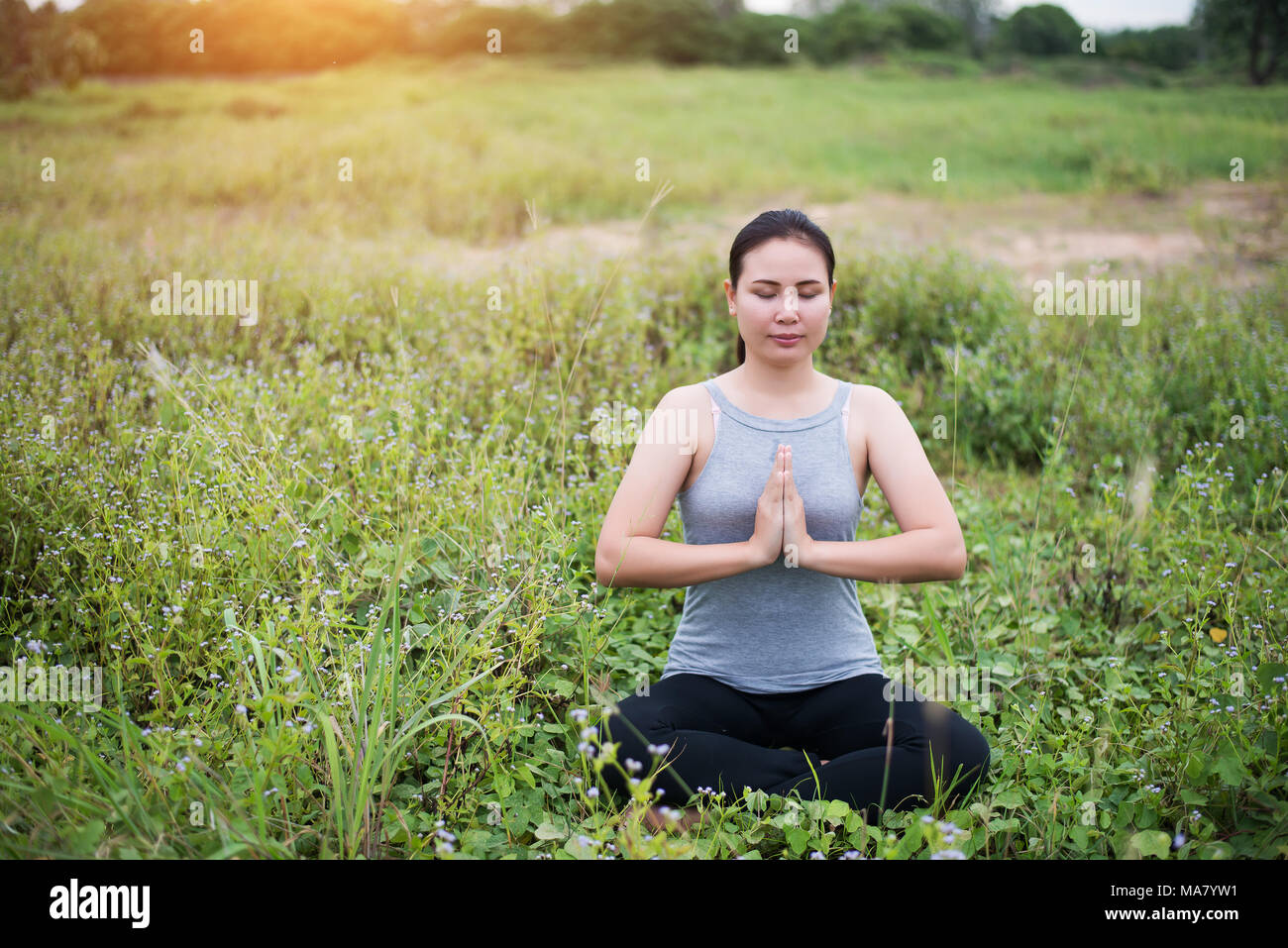 Beautiful yoga woman in the prayer position Stock Photo - Alamy