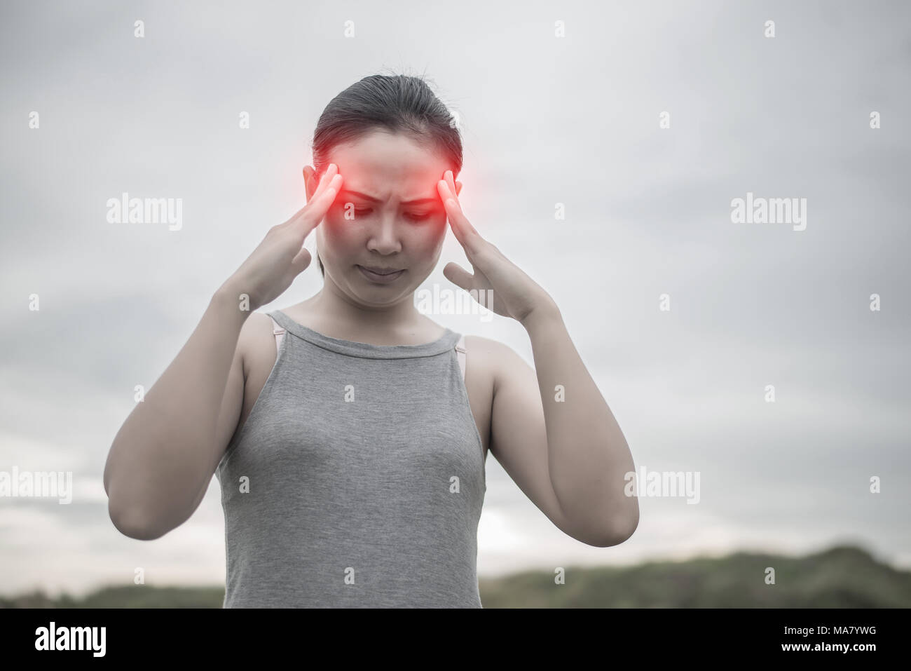 young beautiful asian woman headache Stock Photo - Alamy
