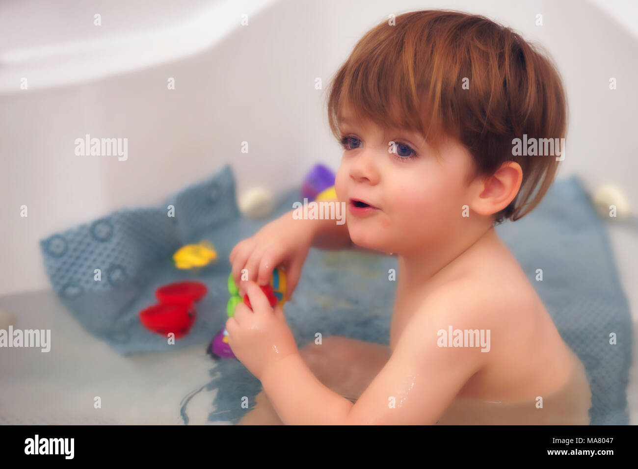 Infant taking a bath hi-res stock photography and images - Alamy
