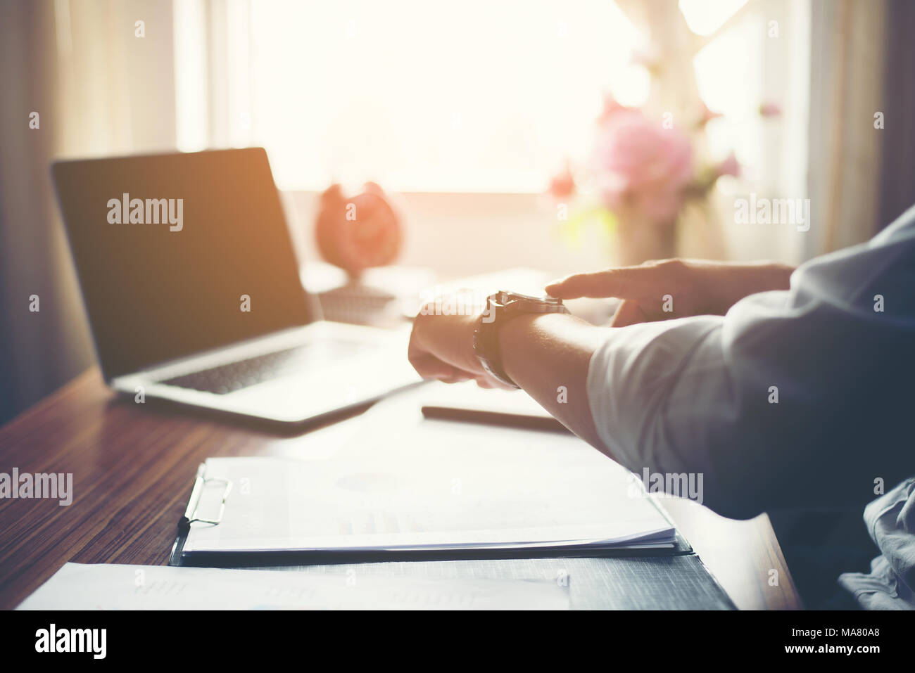 Boss talking to businessman sitting look his watch,late for work Stock ...