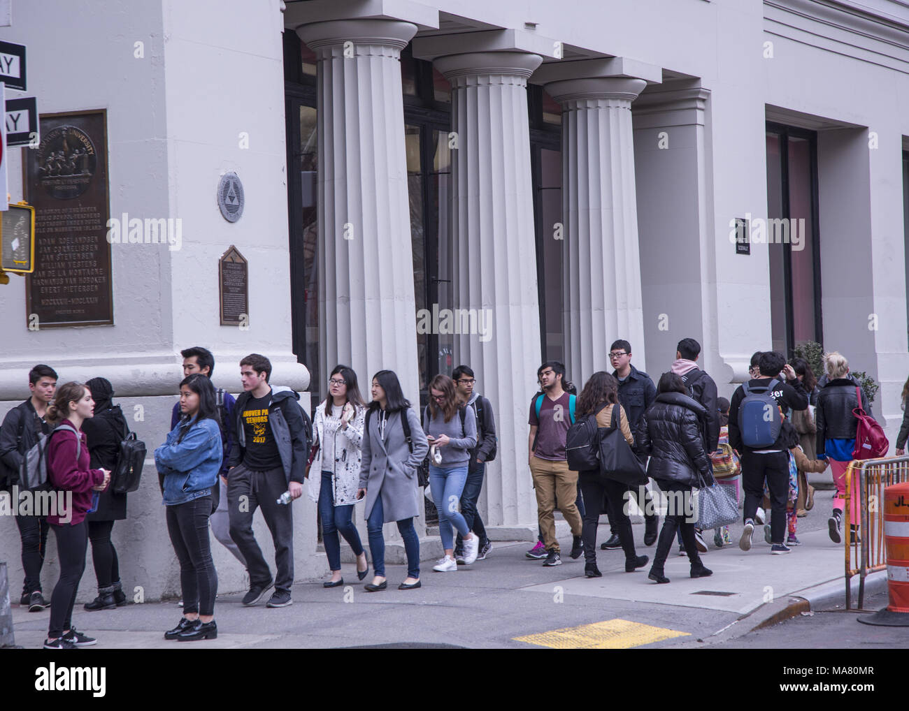 NY University students changing classes on the street at Waverly Pl ...