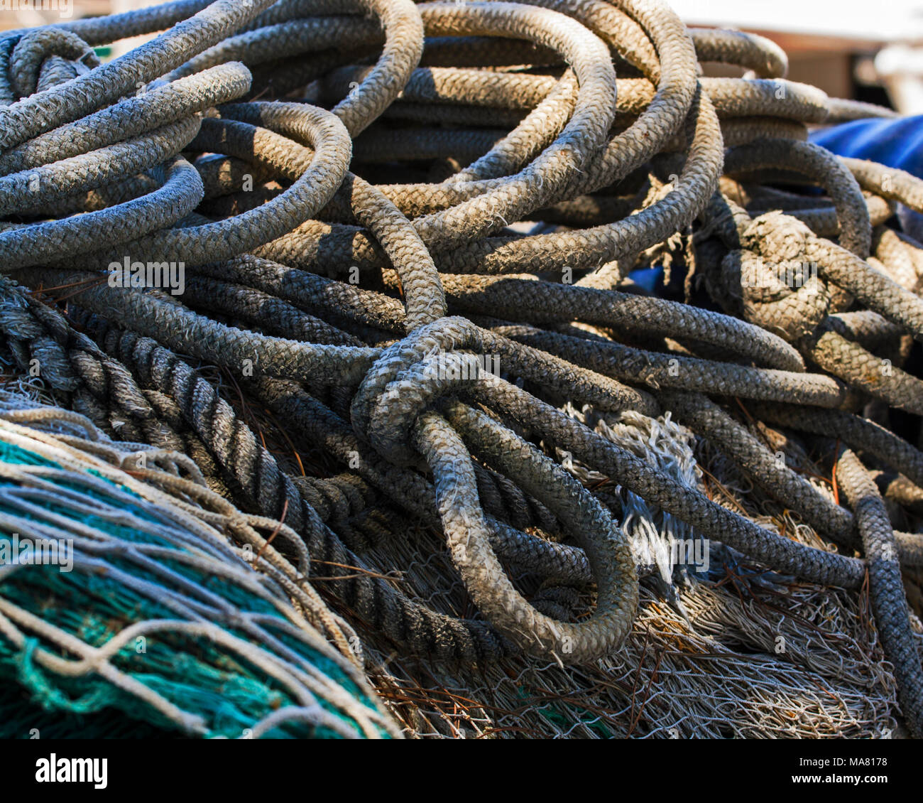 Rolled fishing rope Stock Photo - Alamy