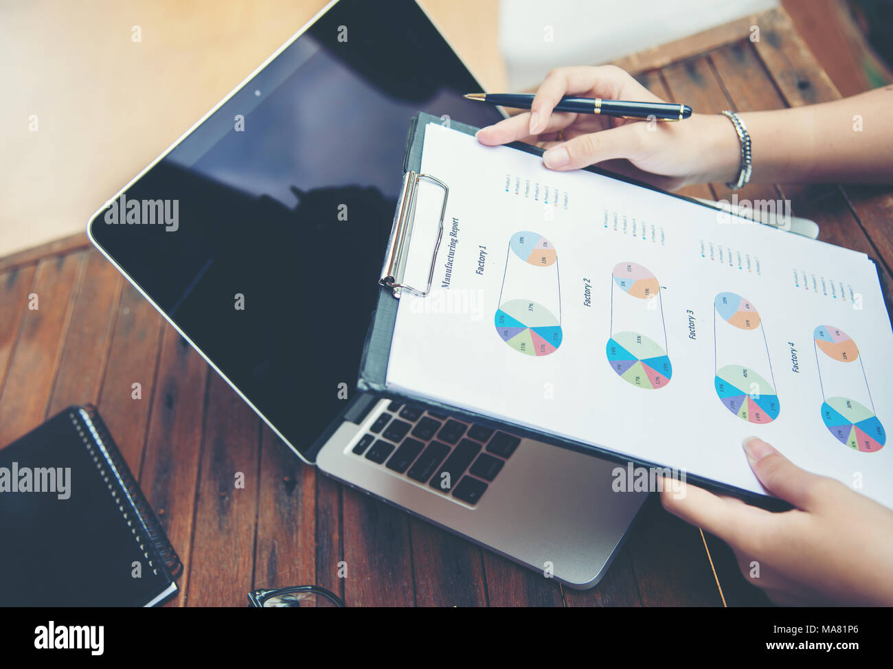 Young business woman hands analysis with business chart on workplace ...