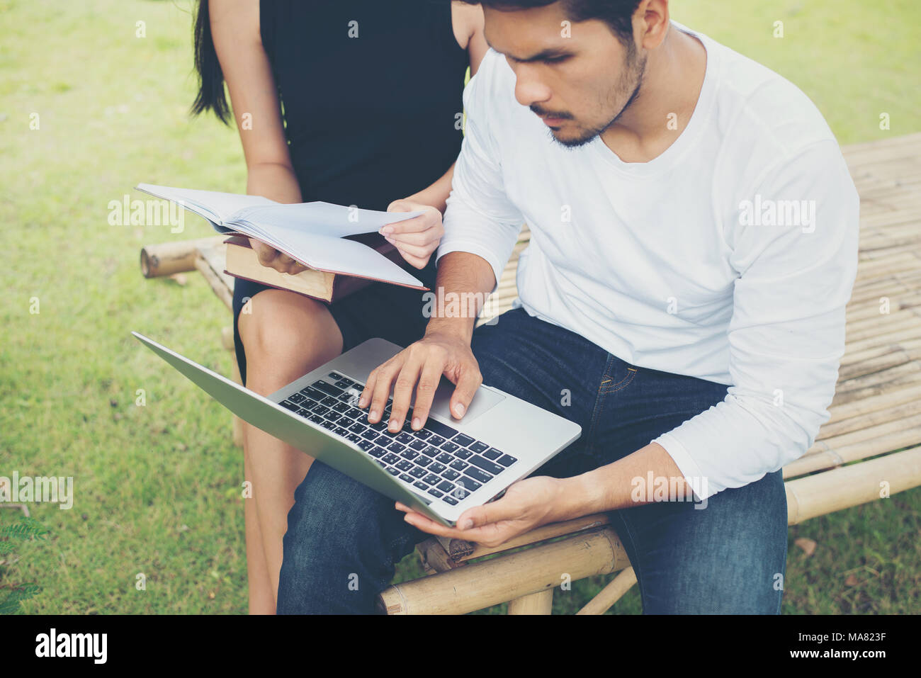 Young education couple practice together hand typing on laptop and ...