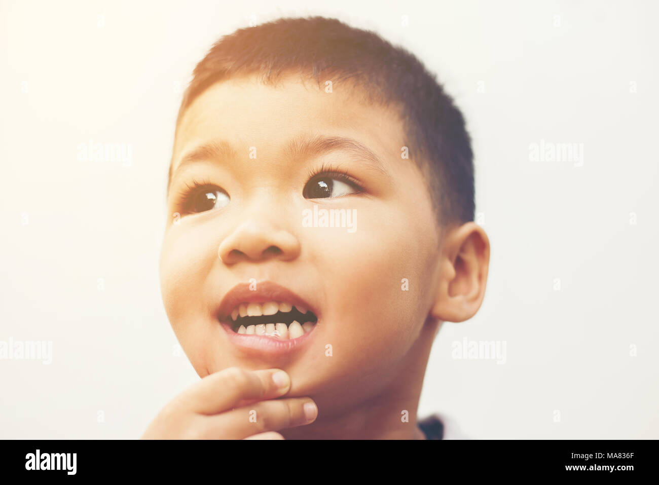Happy boy laugh looking at camera portrait with isolate white ...