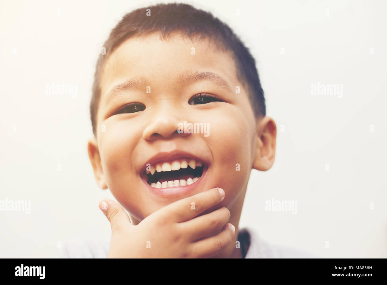 Happy boy laugh looking at camera portrait with isolate white ...
