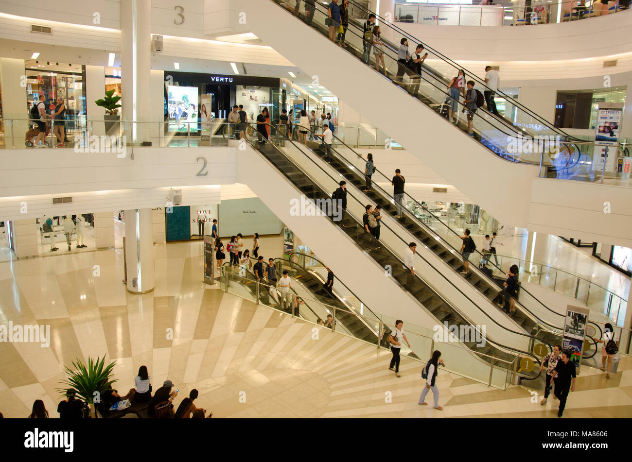 People sitting and wait at meeting point and people walking and use ...
