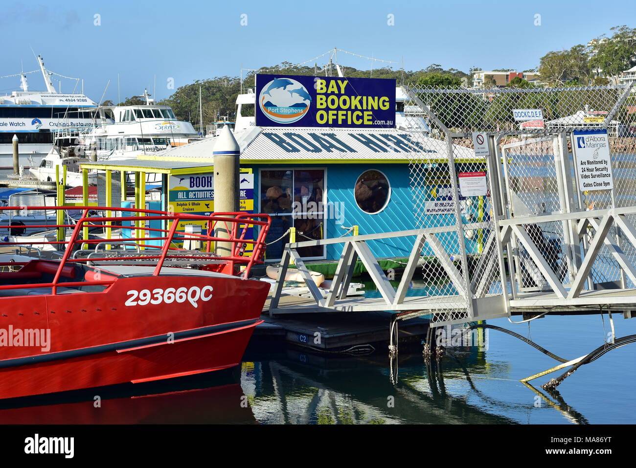 Bay Booking Office building on floating wharf among boats in Nelson Bay ...