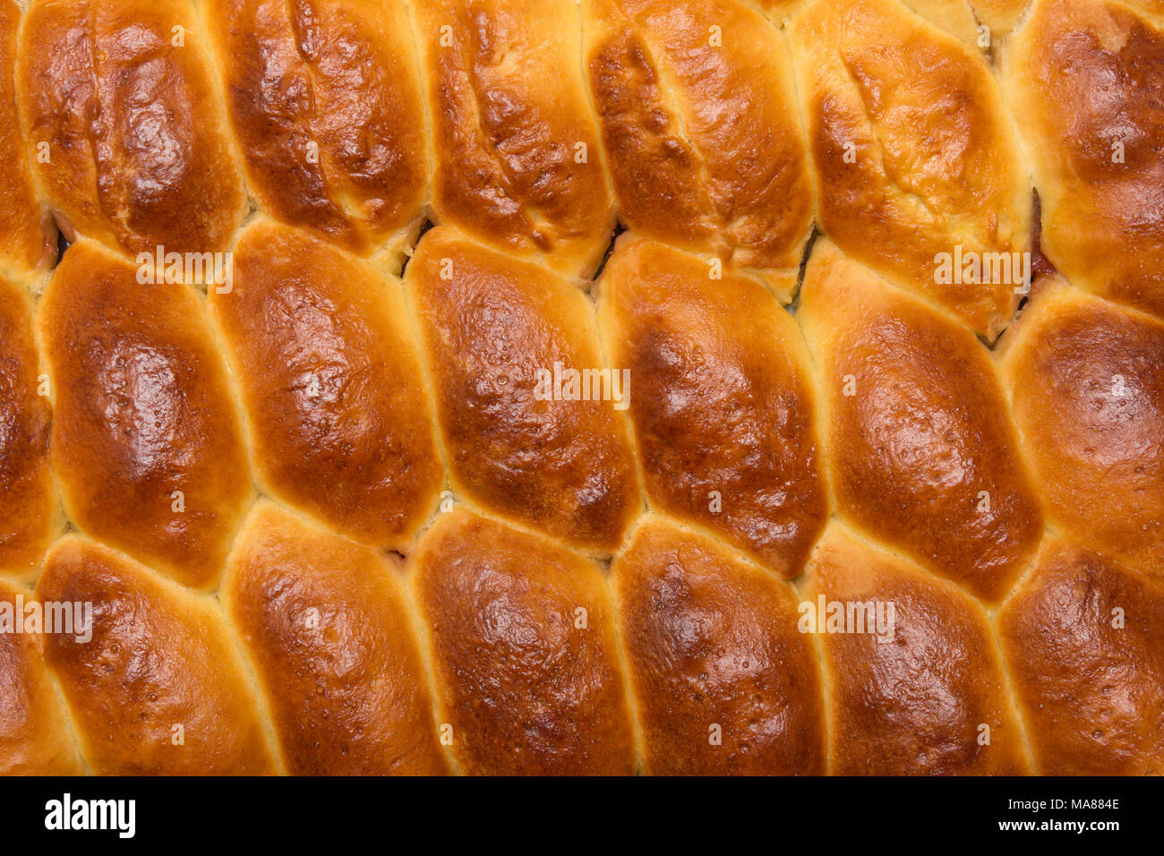 Homemade pastry. A cake with apples and cherries is made at home ...
