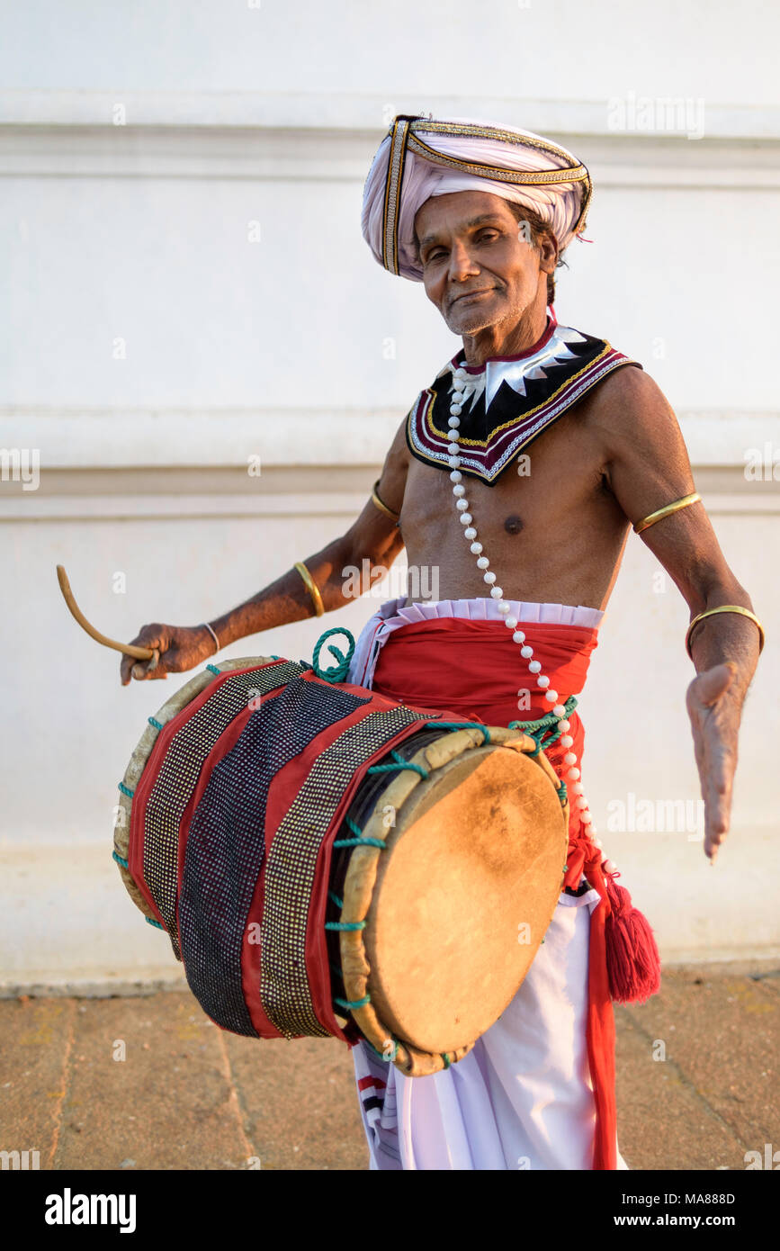 Musicians playing for sunset at Mihintale rock temple Stock Photo - Alamy