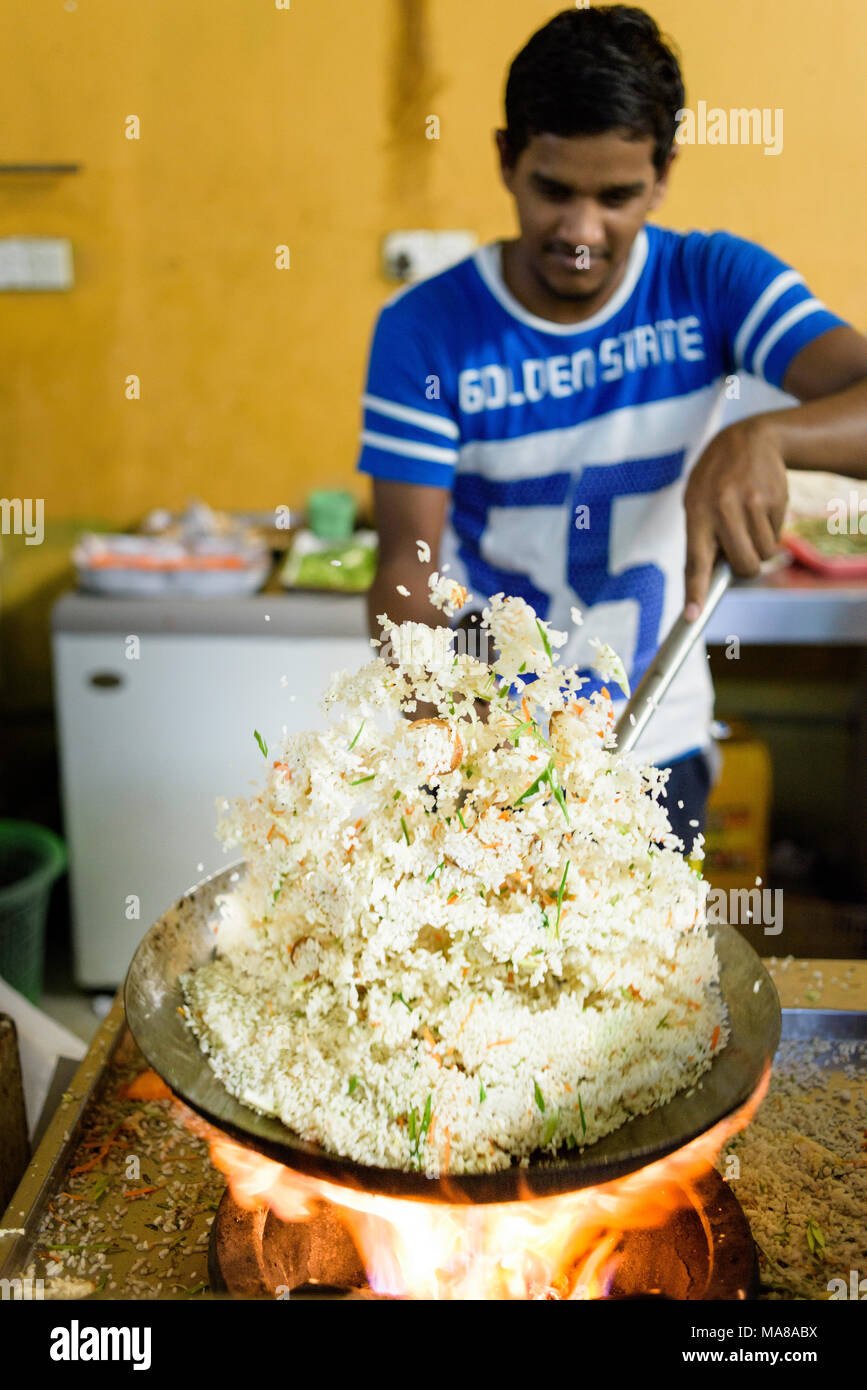 Man cooking fried rice in a big pan Stock Photo - Alamy