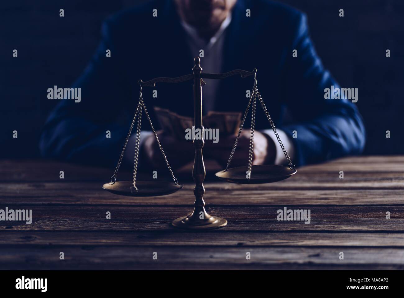 Male lawyer in his office counting money. Law and corruption concept ...