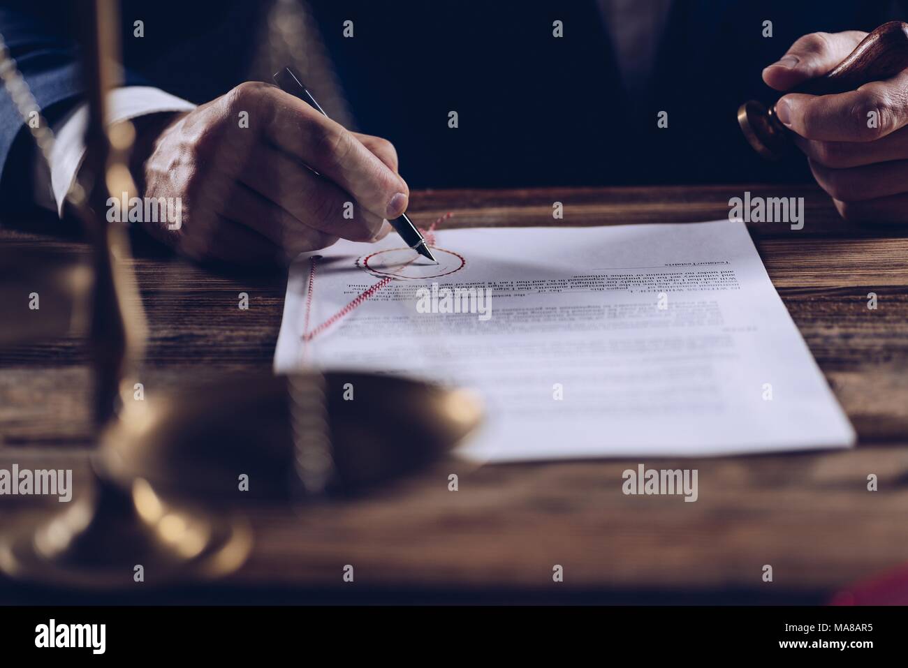 Notary public notarizes document in his office. Law concept Stock Photo ...