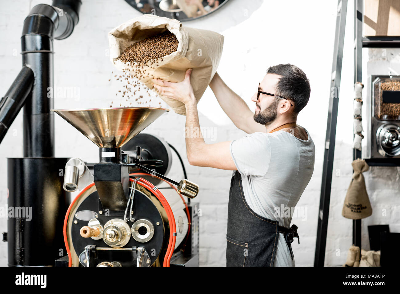 Working professional coffee roasting machine hi-res stock photography ...