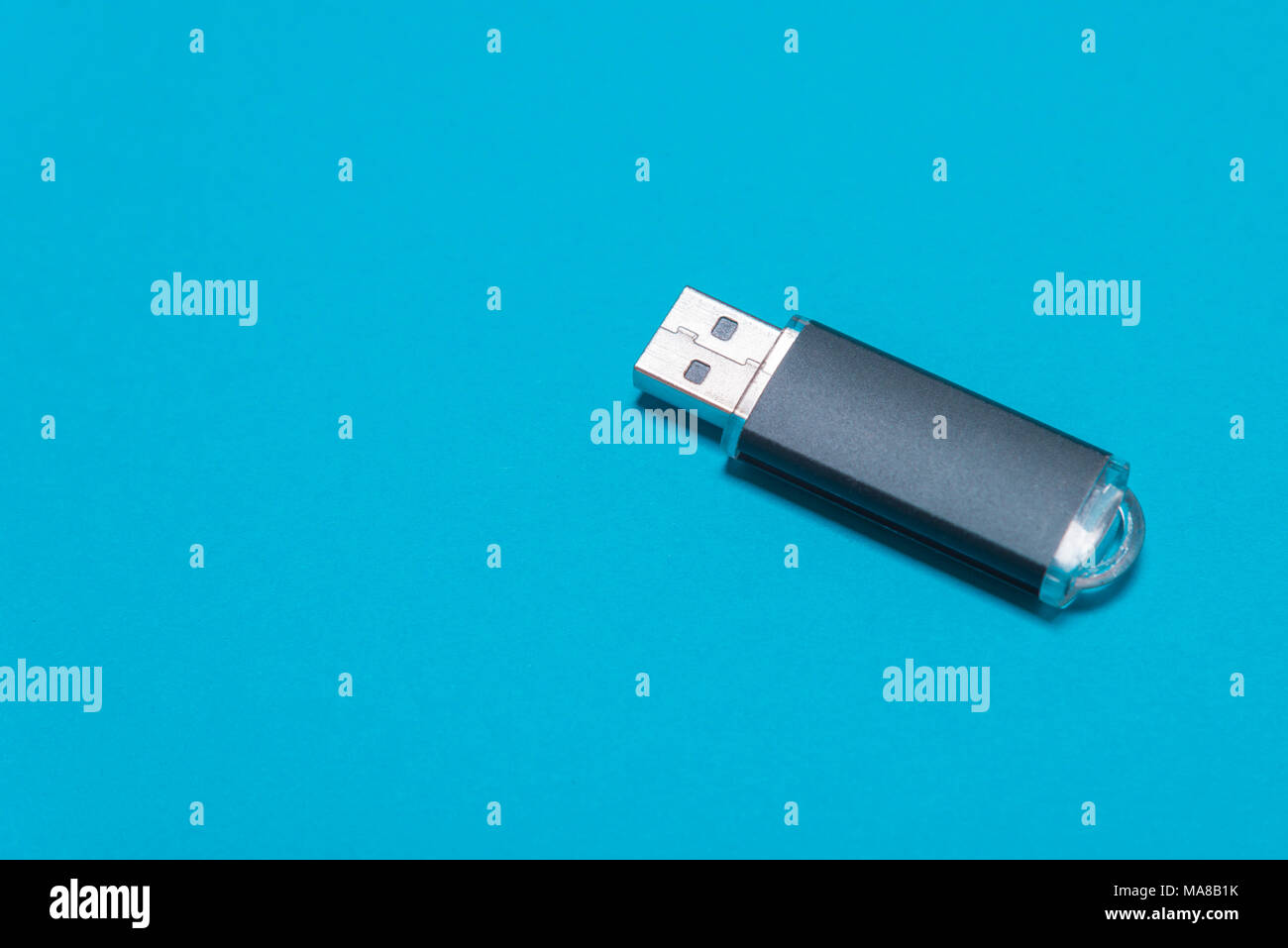 A dark flash drive, a storage medium lying on the background Stock ...
