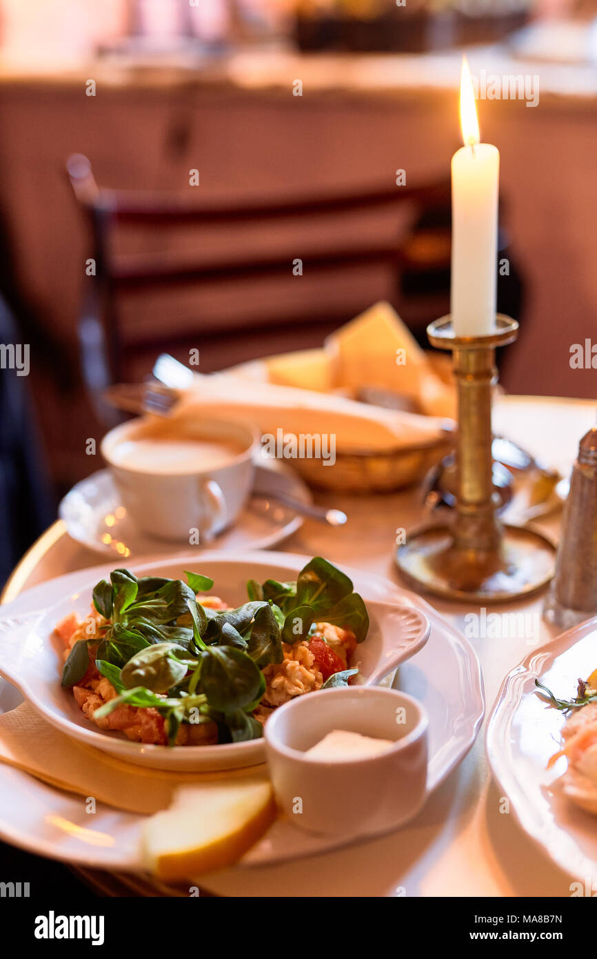 Table with delicious breakfast food near the window Stock Photo - Alamy