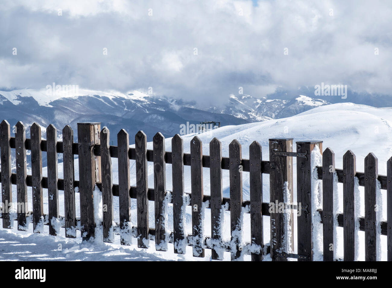 wooden fence and snowy mountains Stock Photo - Alamy