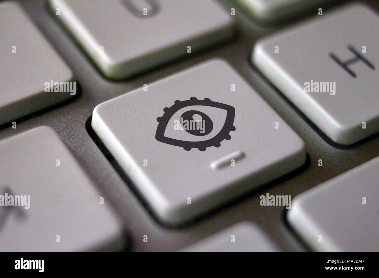 Image of eye icon on computer keyboard button Stock Photo - Alamy