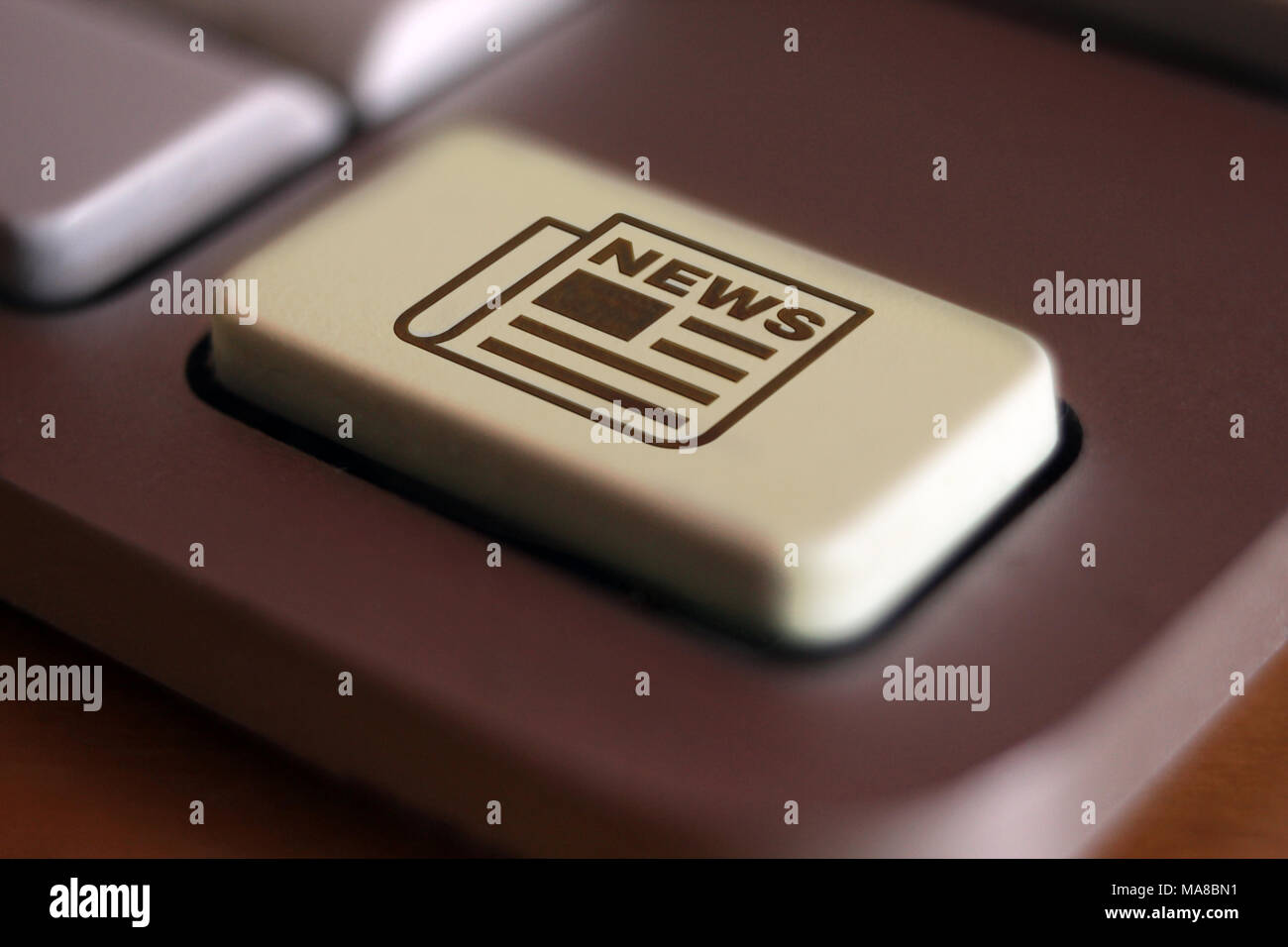 Image of newspaper icon on computer keyboard Stock Photo - Alamy