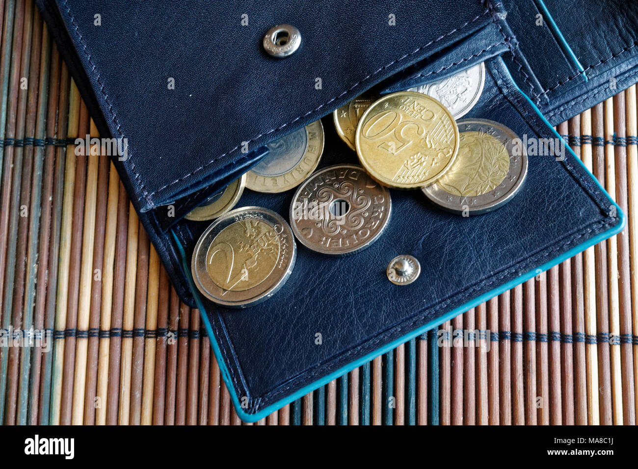 Pile of euro coins in leather black wallet Stock Photo - Alamy