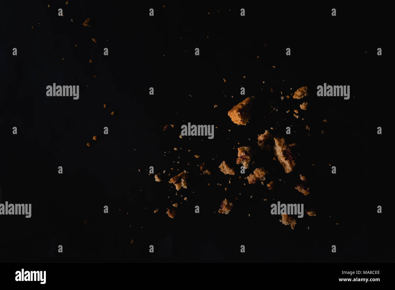 Cookie Crumbs on Black Background Stock Photo - Alamy