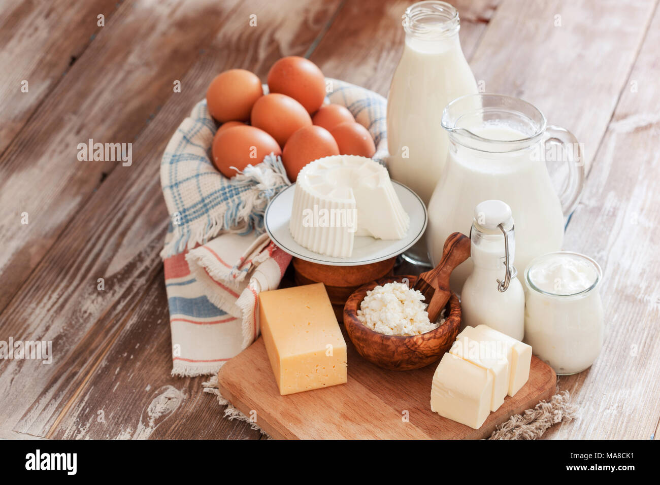 Set of different milk products on ristic wooden table. Milk, cottage ...