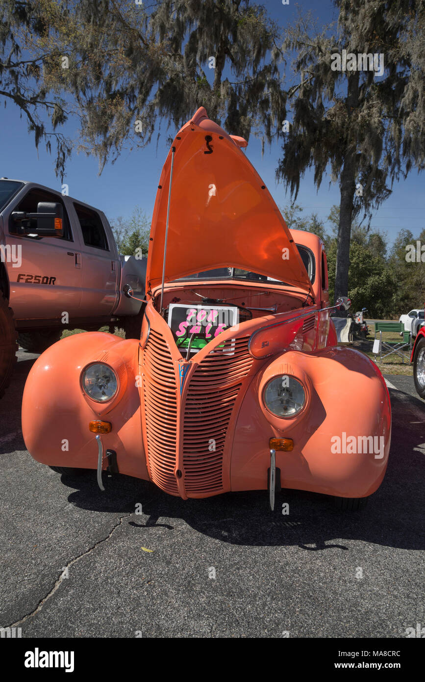 Car Show in Ft. White, Florida. 1939 bright orange Ford sedan with V8 ...