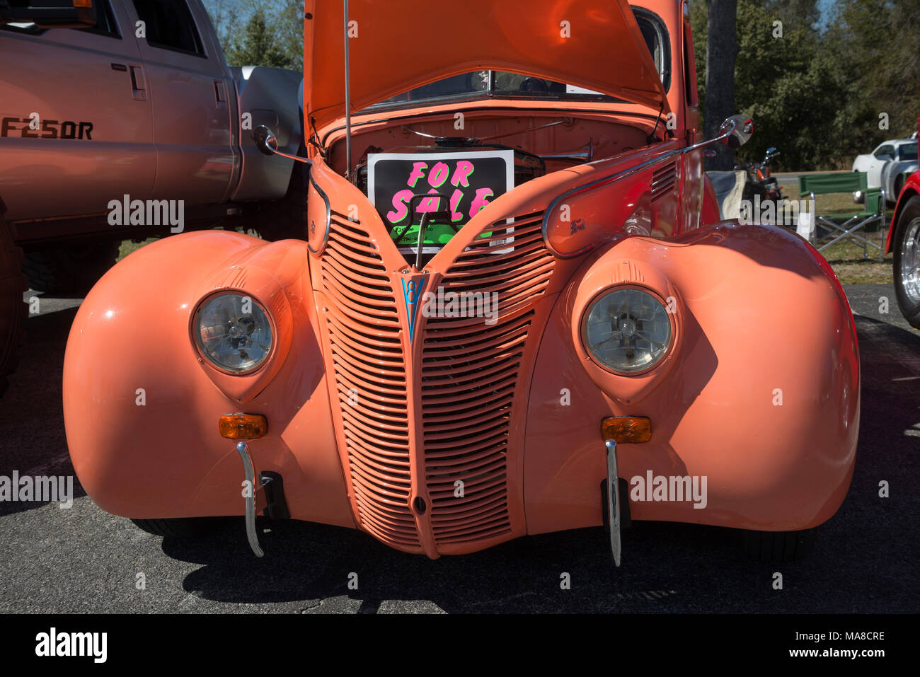 Car Show in Ft. White, Florida. 1939 bright orange Ford sedan with V8 ...