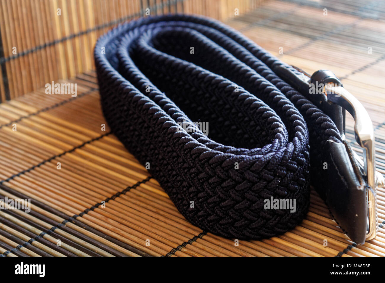 Fashion blue Belt isolated on wooden background Stock Photo - Alamy