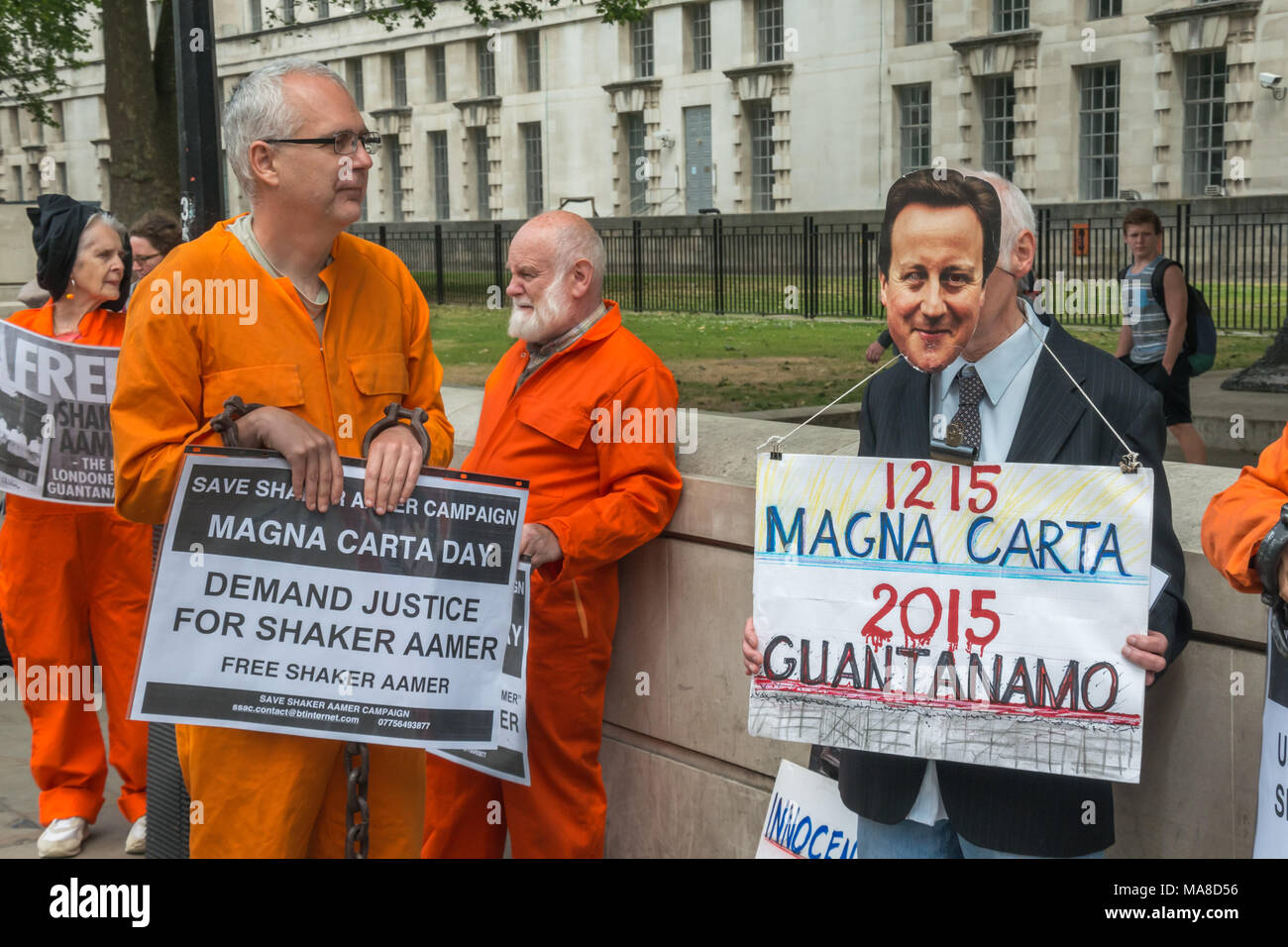 Man in David Cameron mask with placard '1215 Magna Carta - 2015 ...
