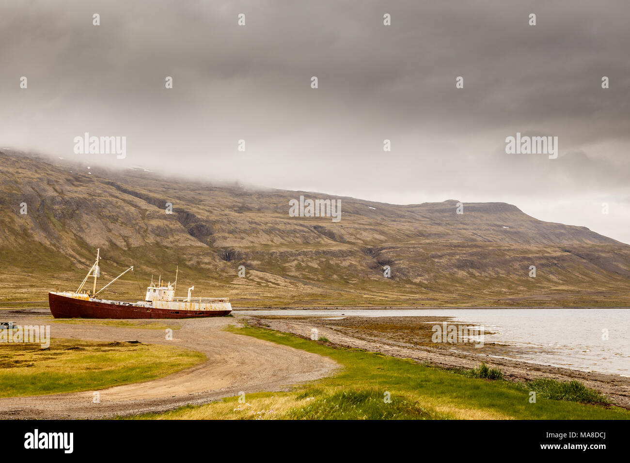 Oldest steel ship in Iceland abandoned rusty ashore in the grass, West ...
