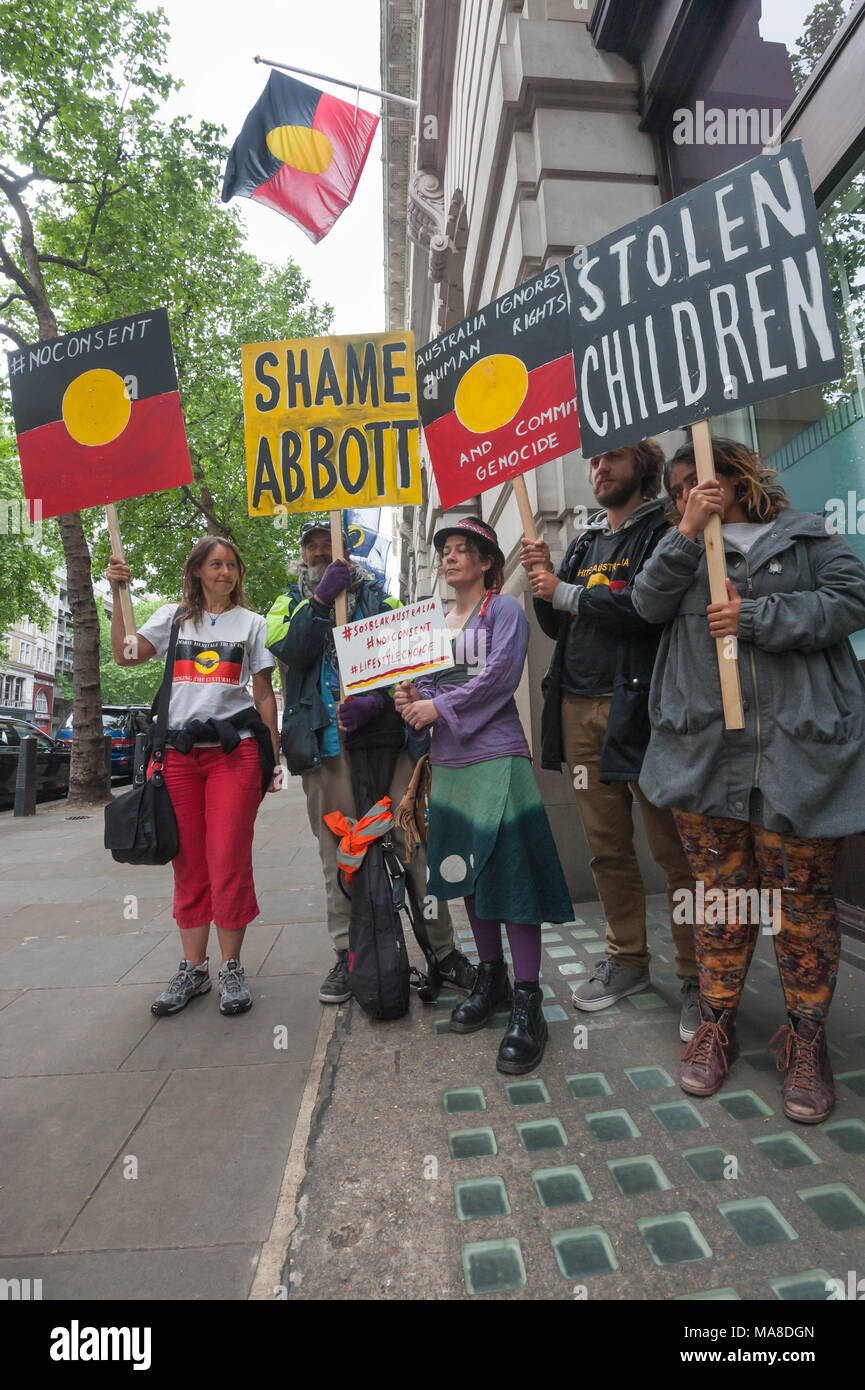 Protesters pose under Aboriginal flag flying on Australia House, London ...