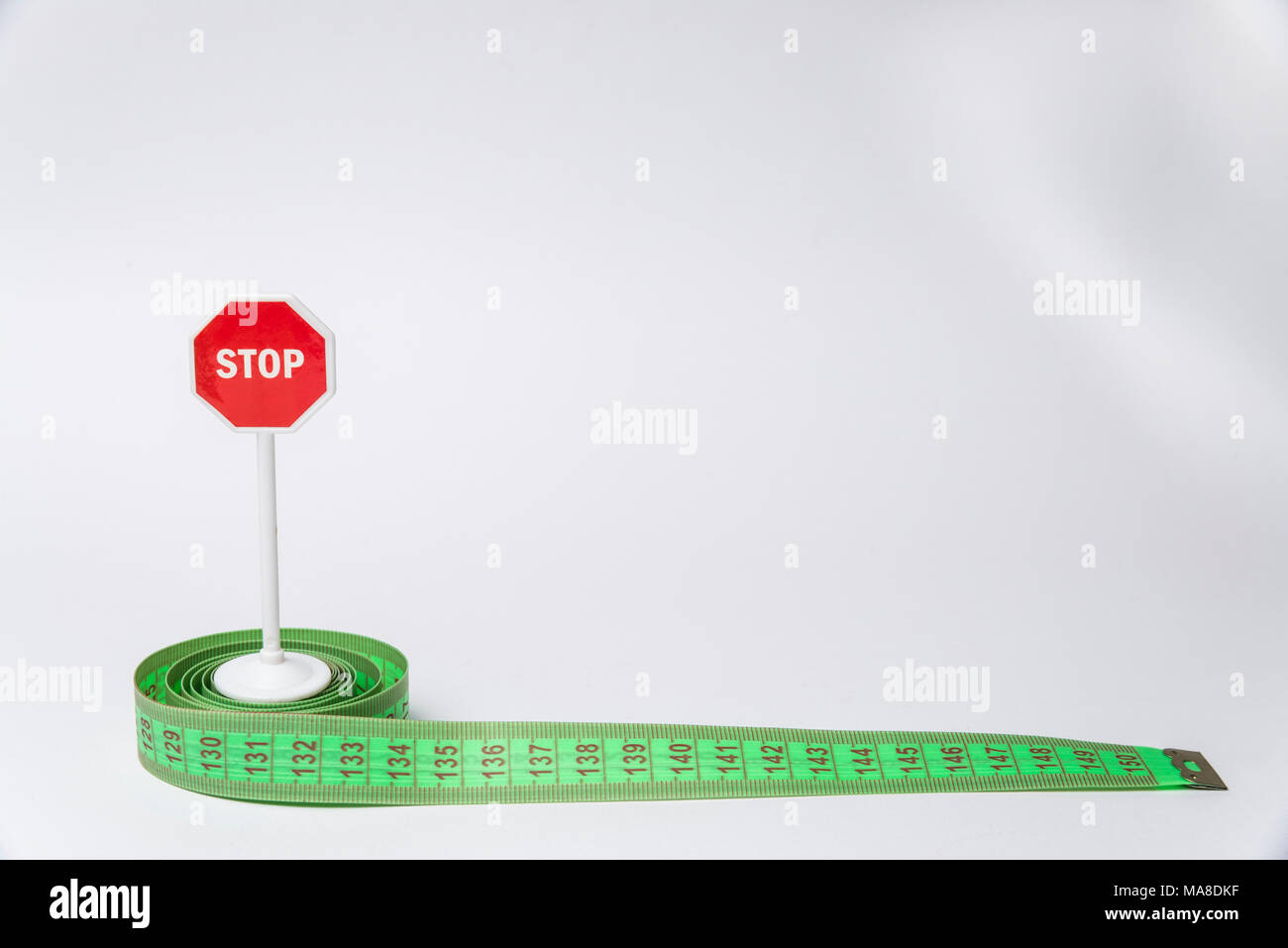 stop sign and meter on white surface Stock Photo - Alamy