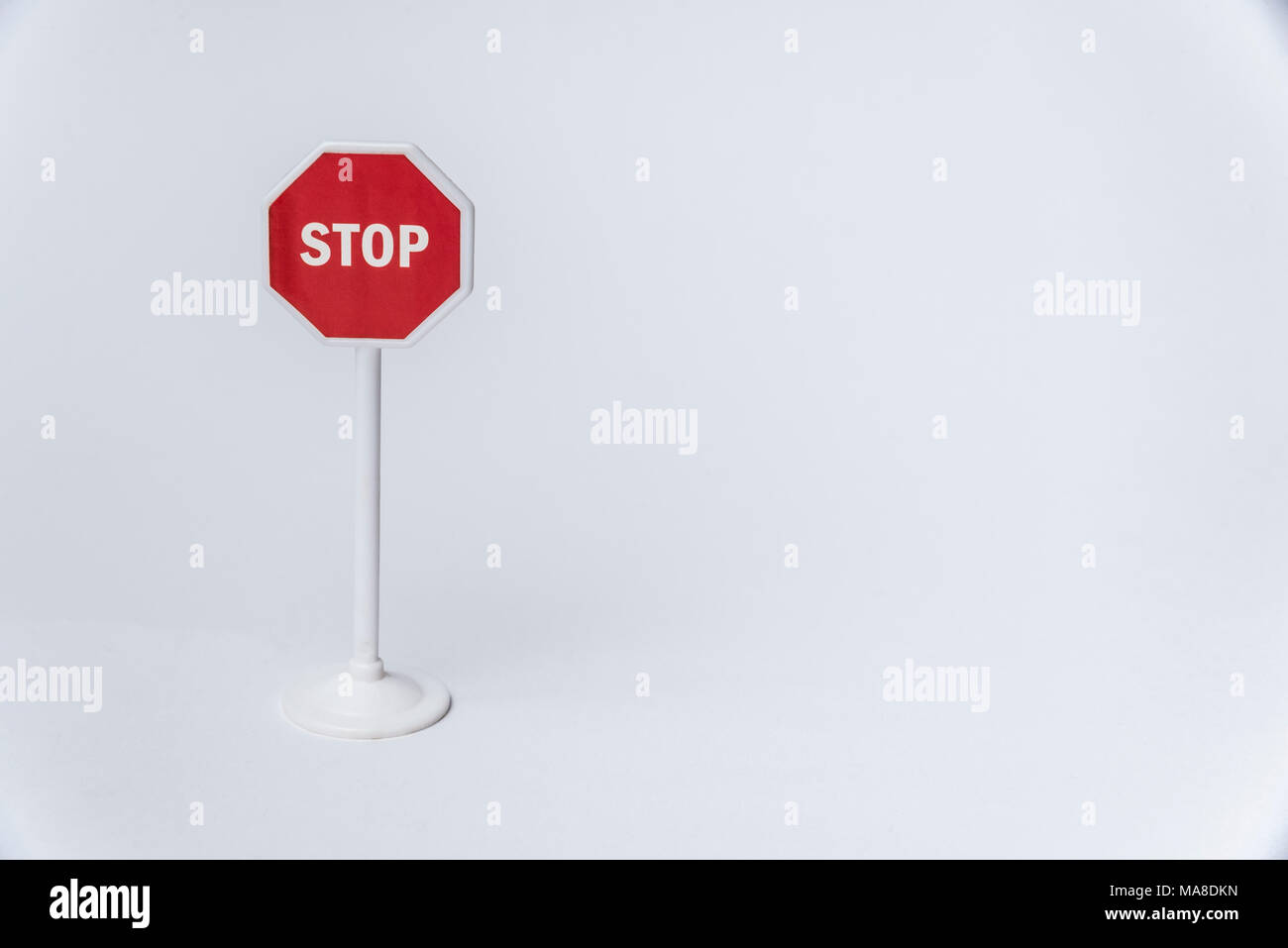 Octagonal red stop sign on white background Stock Photo - Alamy