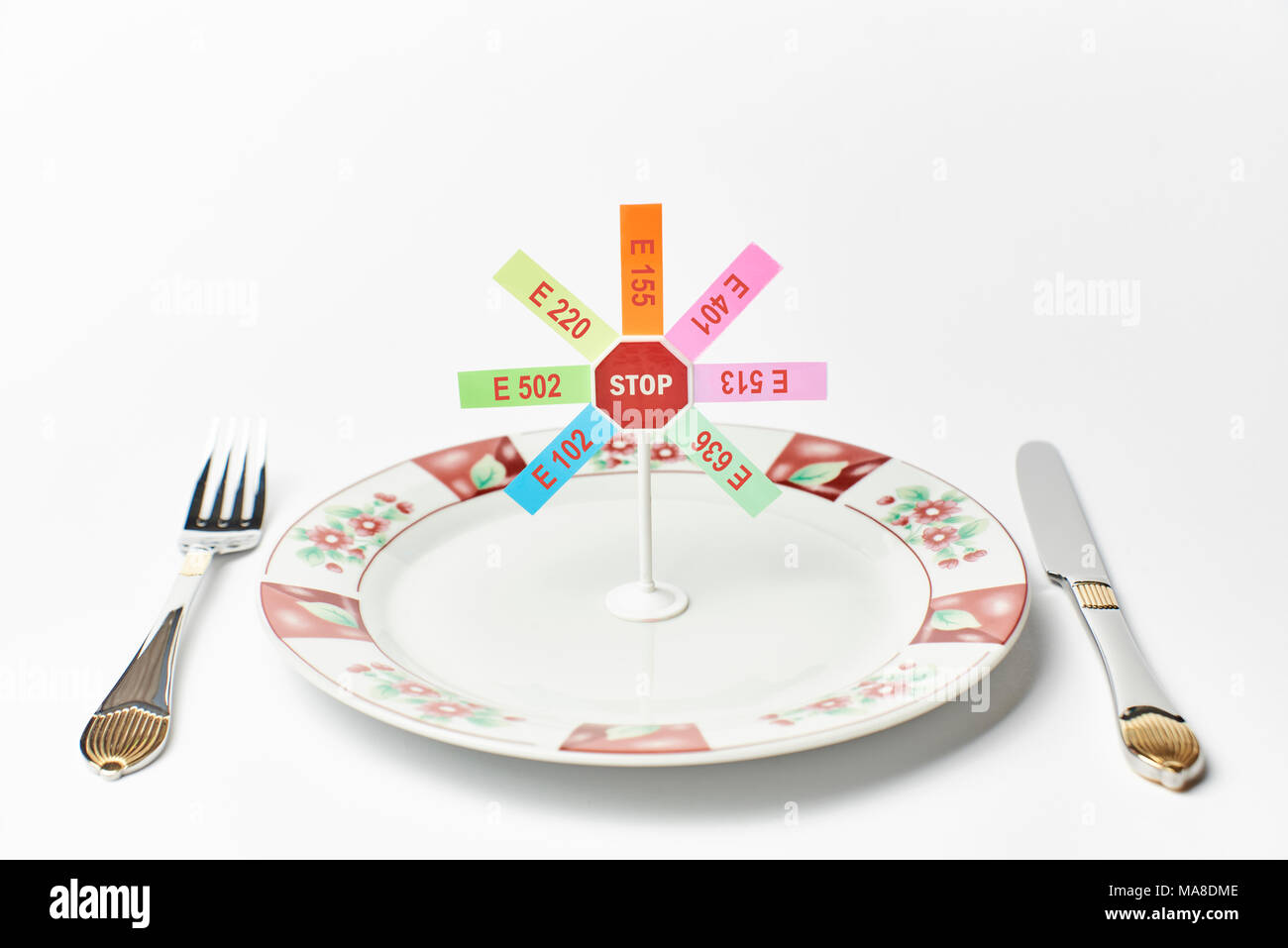 Cutlery and stop sign with banned additives on white background Stock ...