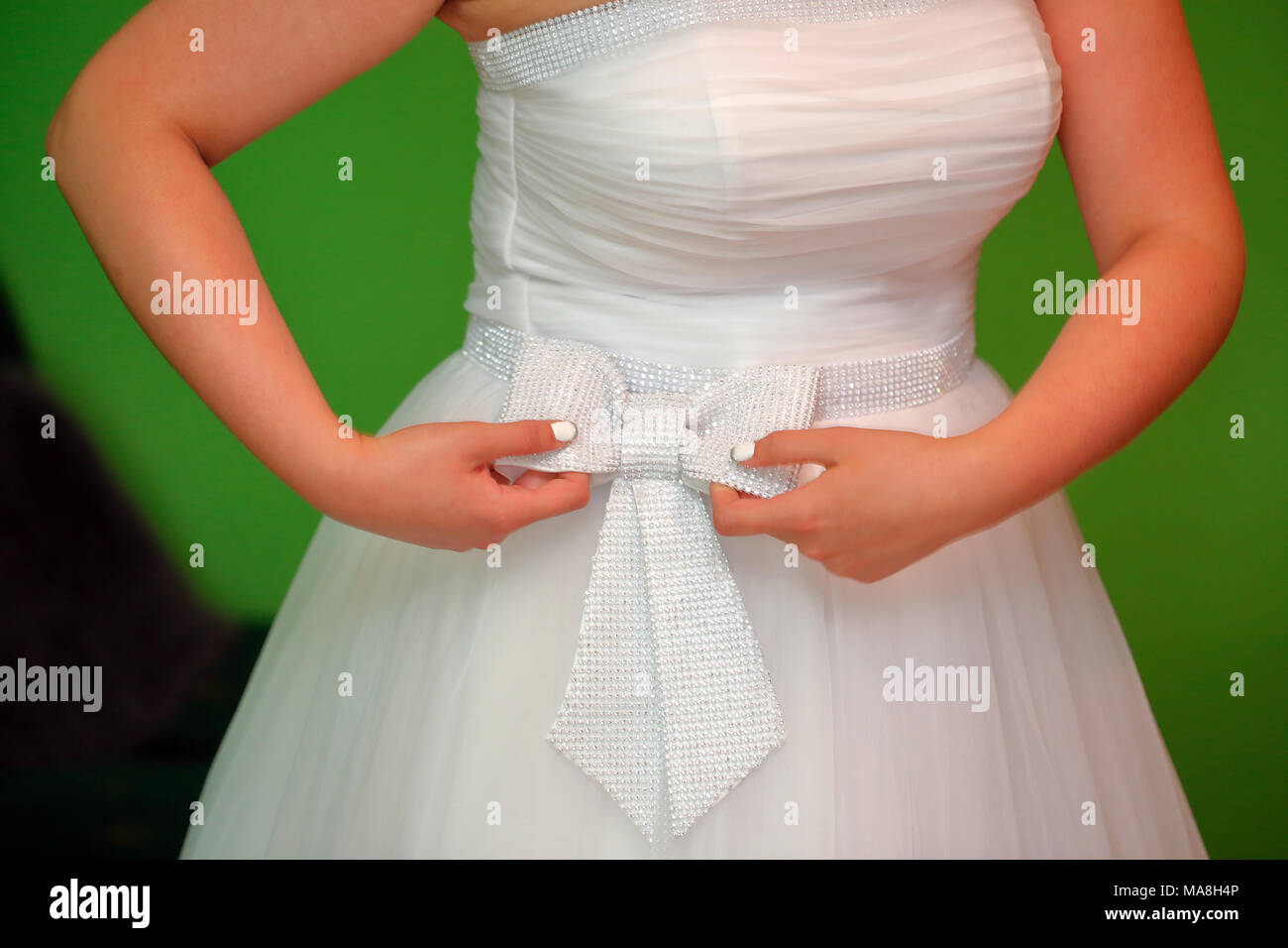 Bride wears a dress on wedding day Stock Photo - Alamy