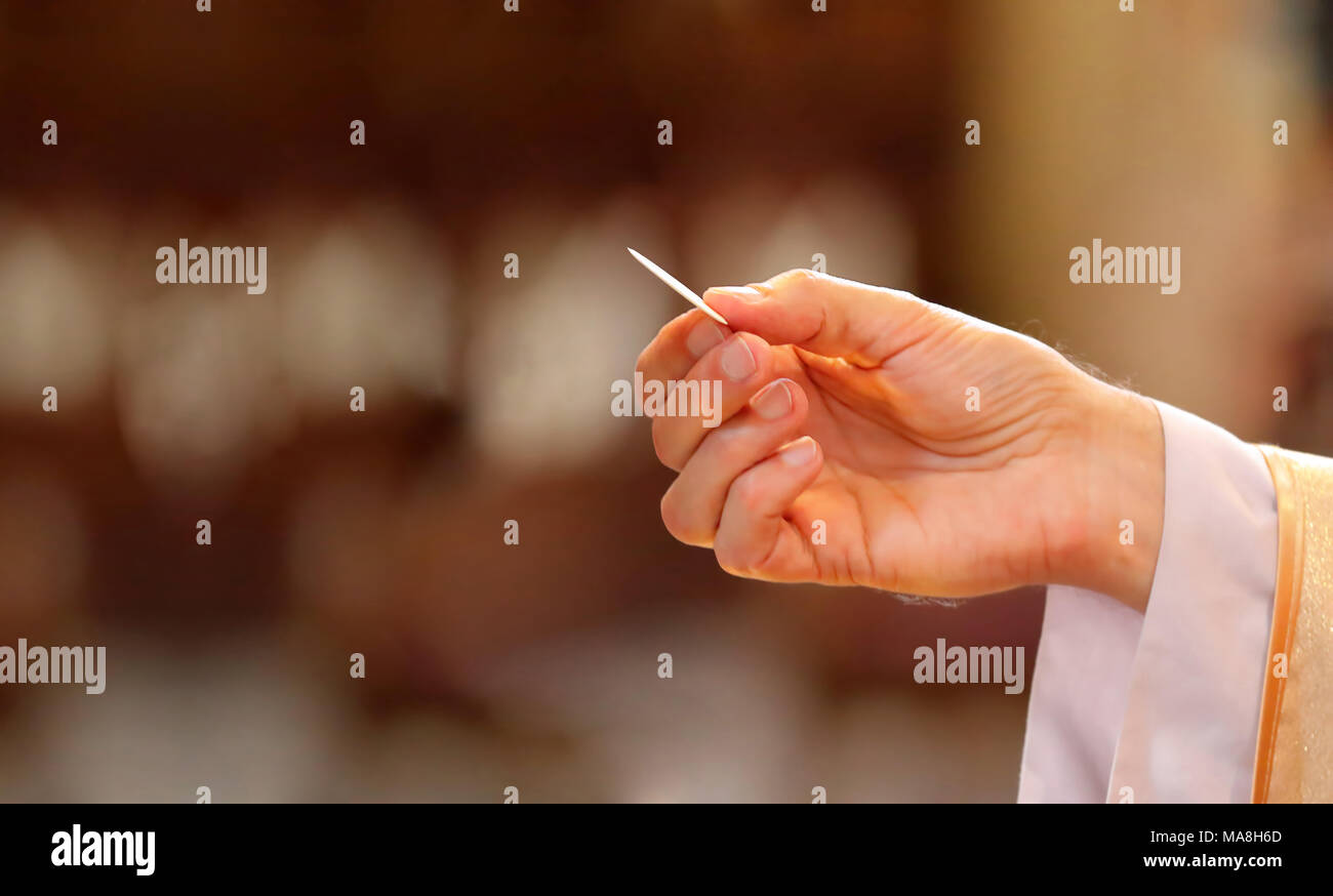 Priest giving communion hi-res stock photography and images - Alamy