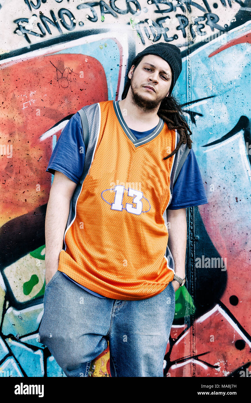 three rap singers in a subway with graffiti in the background Stock ...