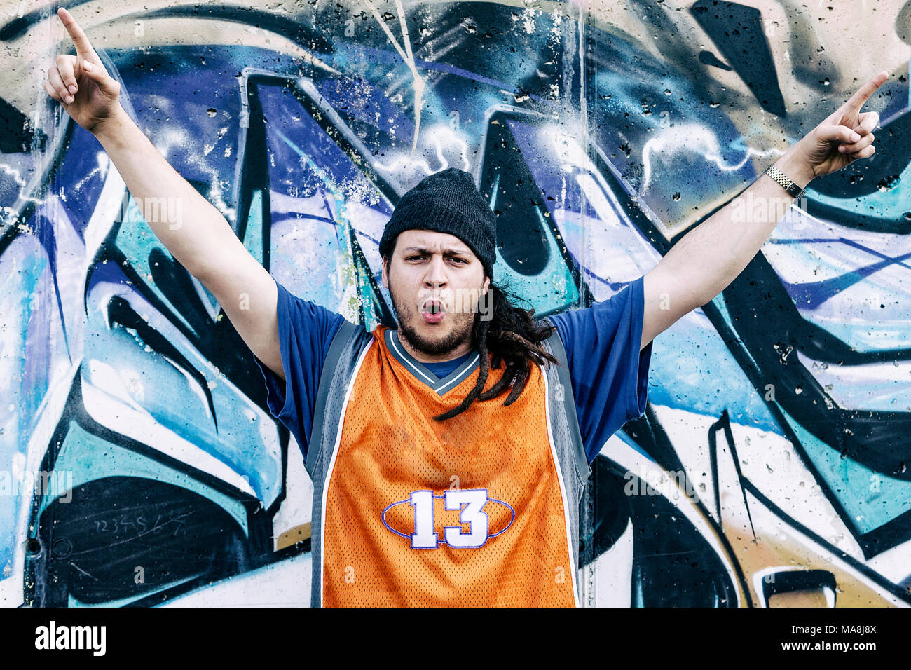 three rap singers in a subway with graffiti in the background Stock ...