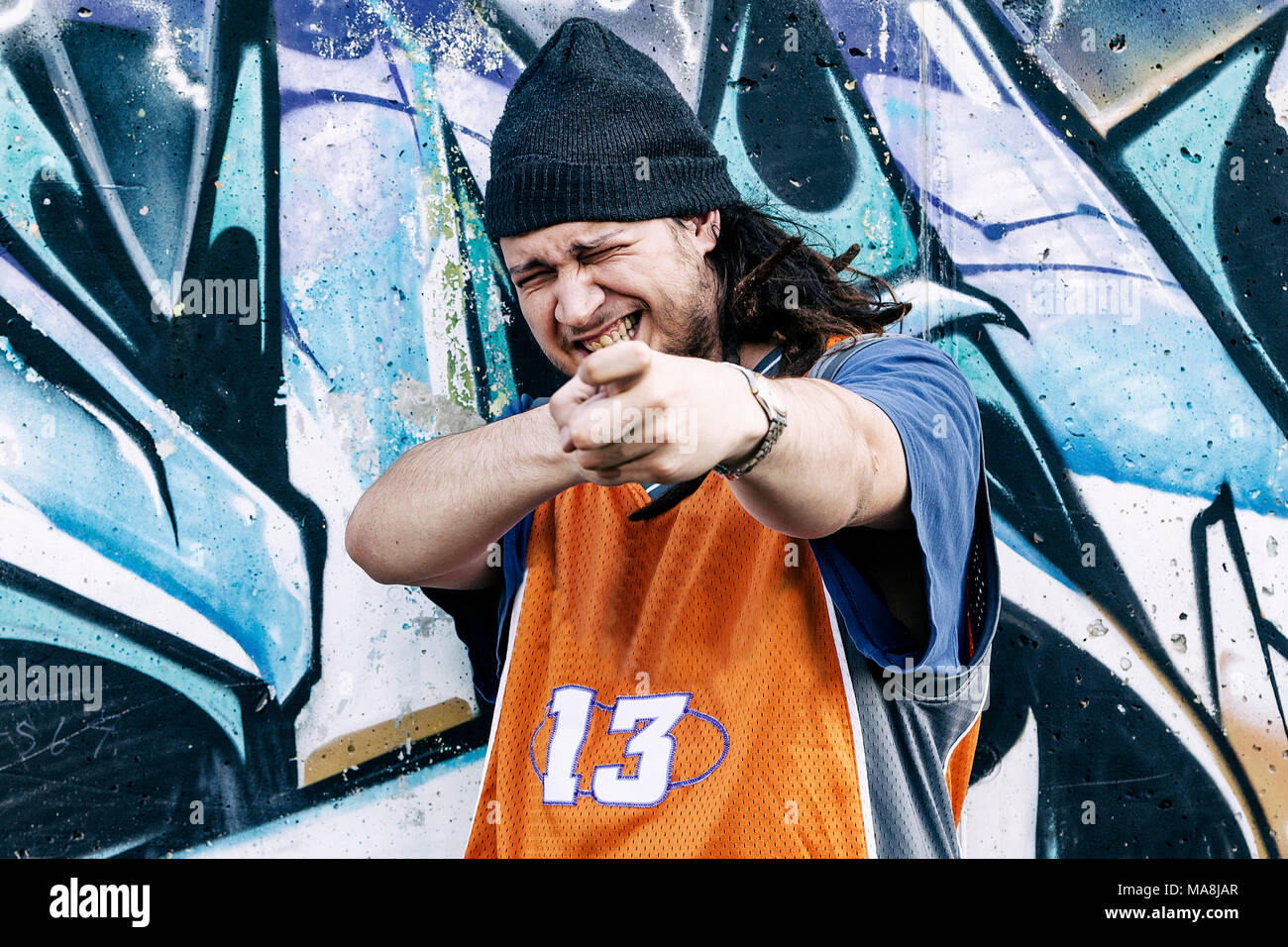 three rap singers in a subway with graffiti in the background Stock ...