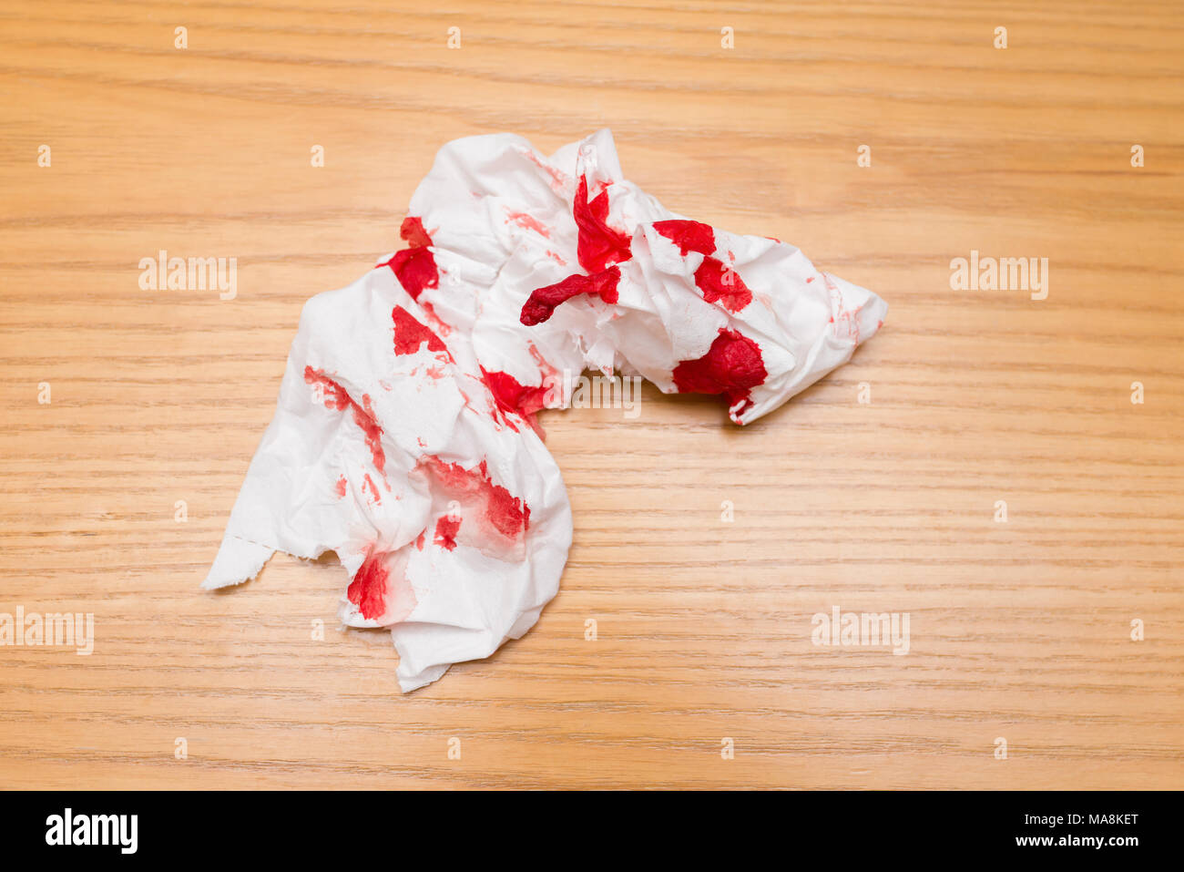 bloody tissue on a wood table Stock Photo - Alamy