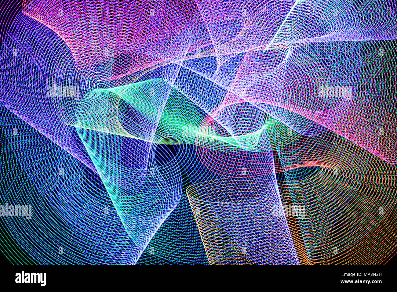 Multi color abstract light painting. LED lights on black background ...