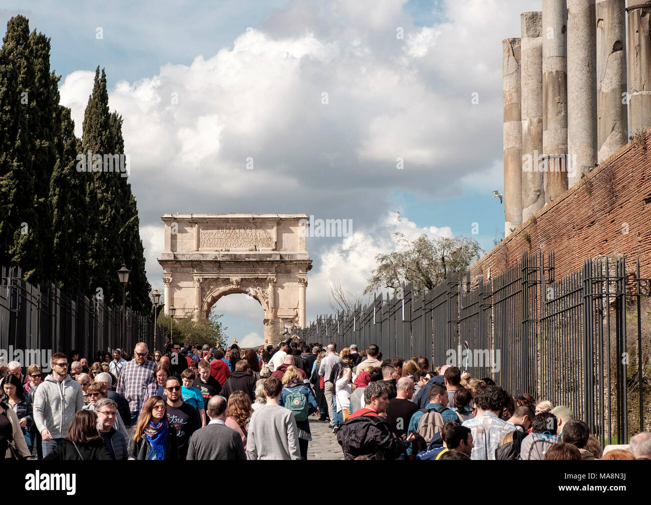 Crowds of tourists pass on a day in early March along Via Sacra towards ...