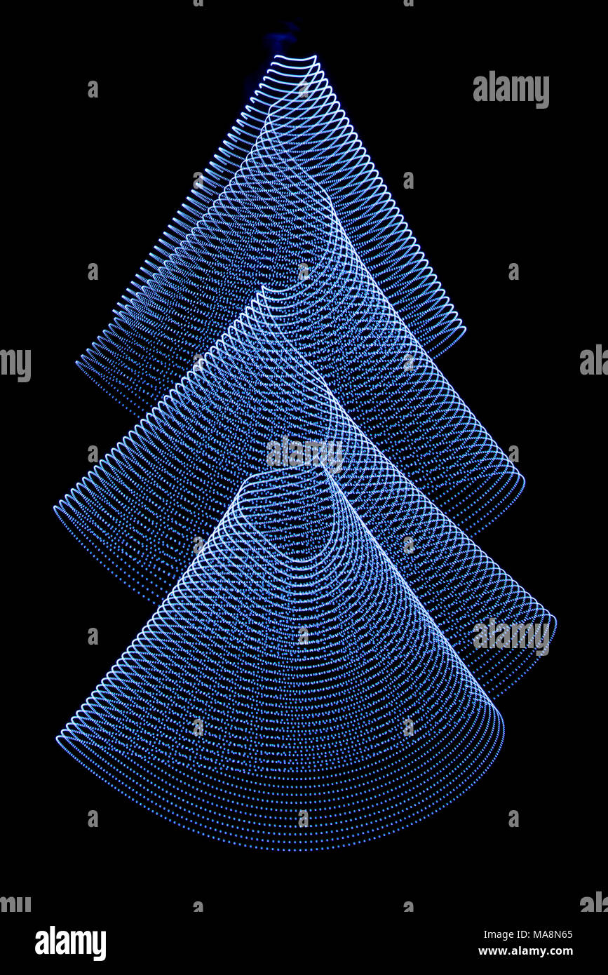 Blue color abstract light painting. LED lights on black background ...