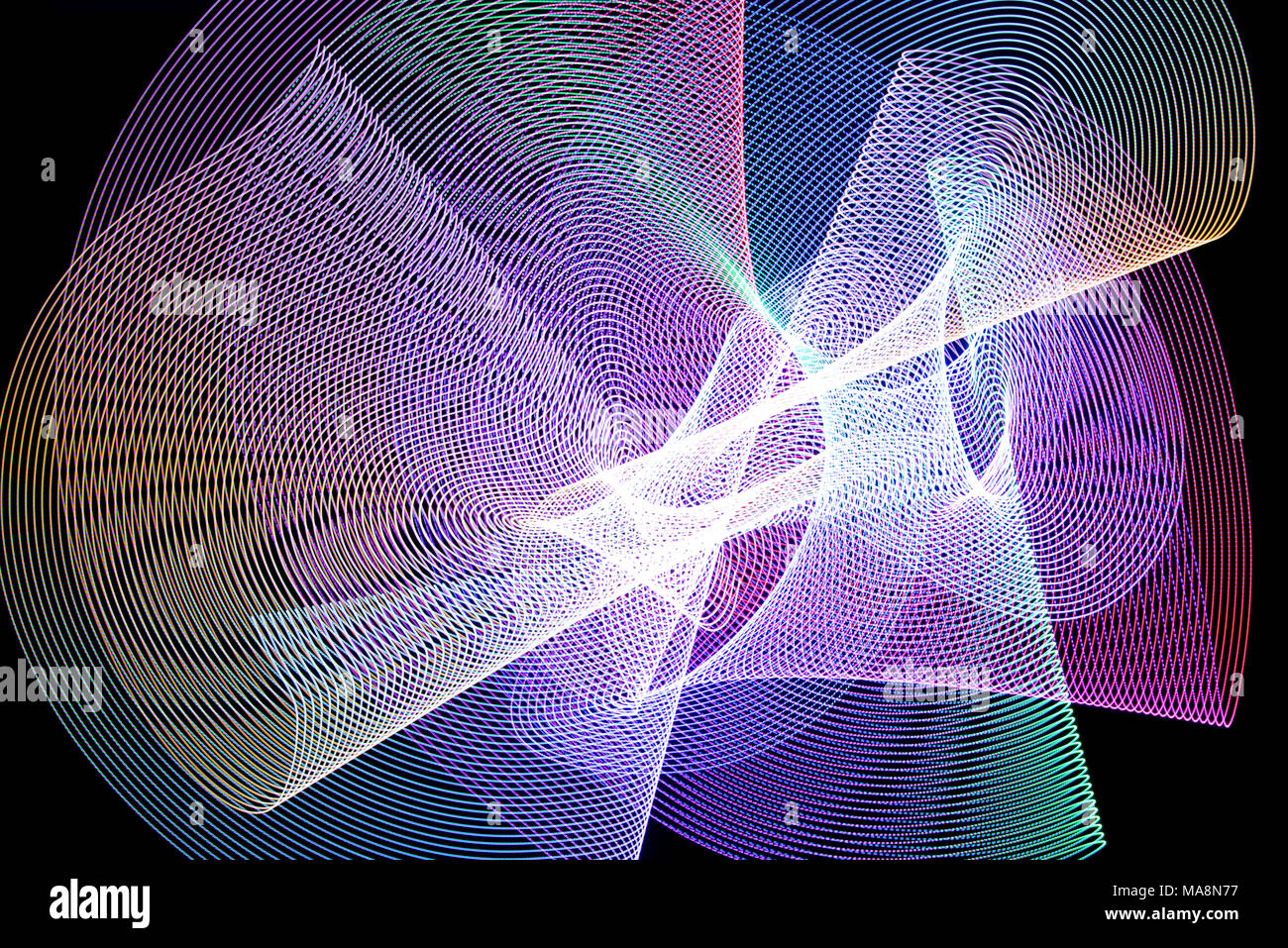 Multi color abstract light painting. LED lights on black background ...