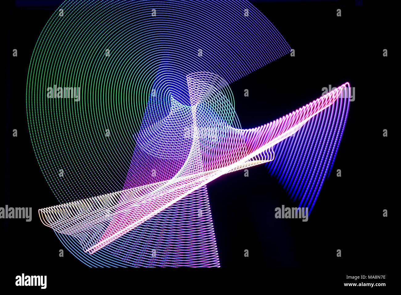 Multi color abstract light painting. LED lights on black background ...