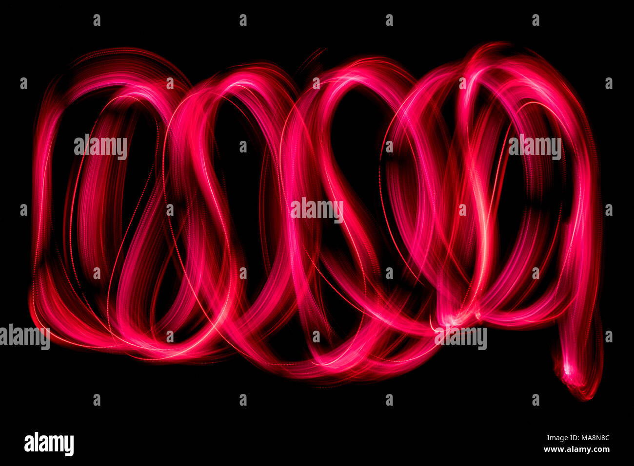 Red color abstract light painting. LED lights on black background Stock ...